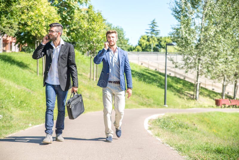 Businessmen Walking Outdoors Stock Photo - Image of cell, male: 43804806