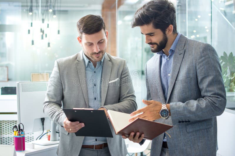 Businessmen Working with Documents Together in Office. Stock Photo ...