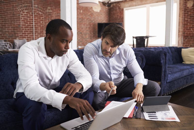 Businessmen Working on Sofas in Relaxation Area of Office Stock Image ...