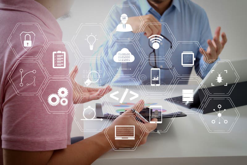 Businessmen Working Together on a Document and Using Smart Phone Stock ...