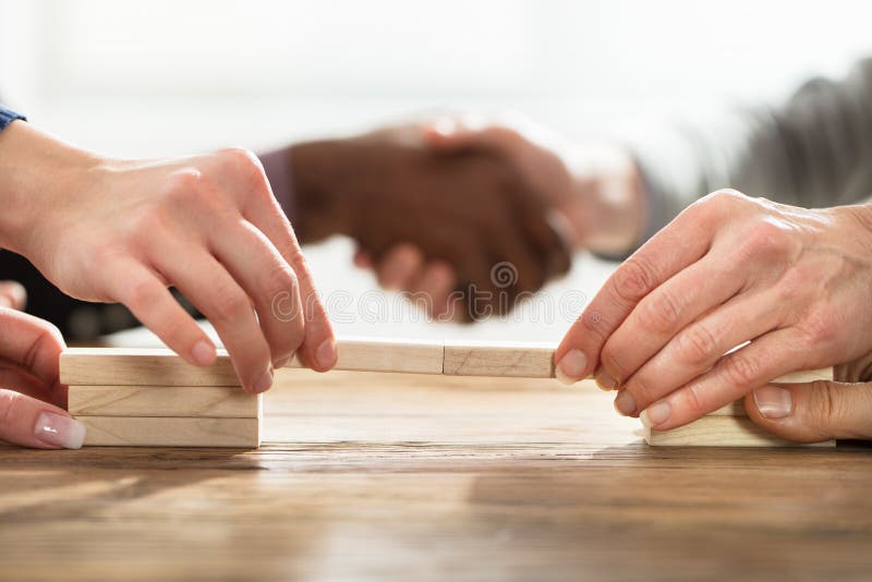 Businesspeople Building Bridge with Wooden Blocks Stock Image - Image ...