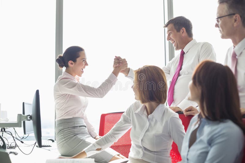 Businesspeople Celebrating Success in Office Stock Image - Image of ...