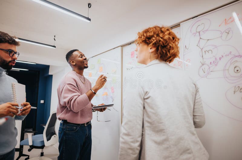 Successful Business Team Collaborating and Brainstorming on a ...