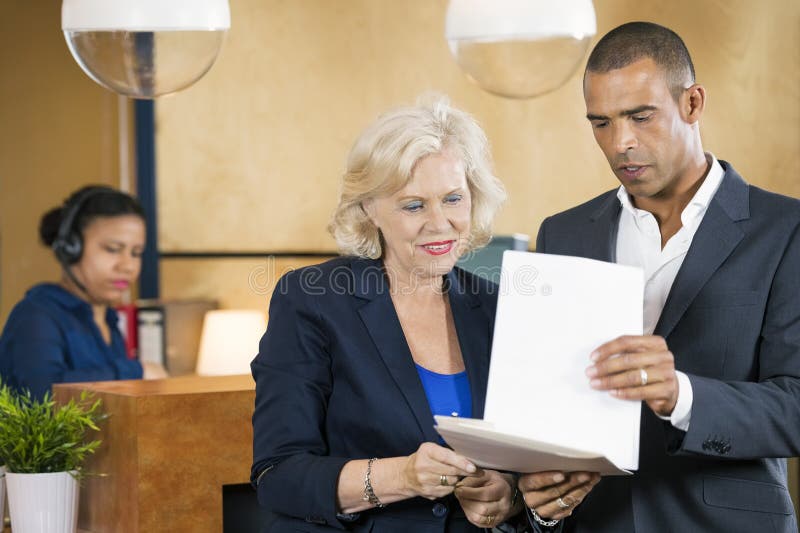 Businesspeople Discussing Over Documents Stock Photo - Image of project ...