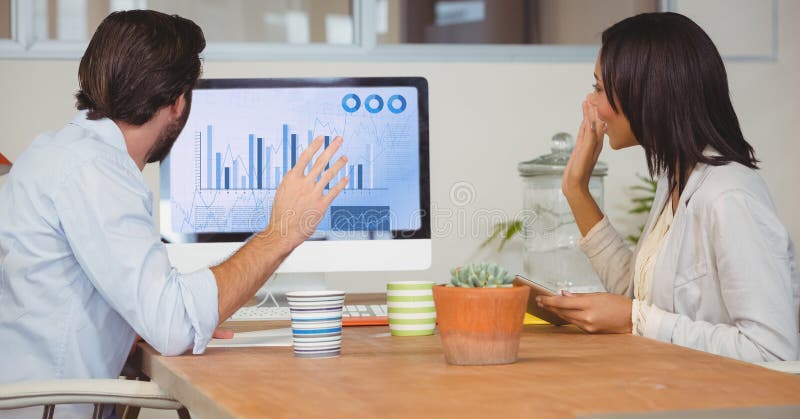 Businesspeople Discussing Over Graphic Chart on Computer Stock Image ...