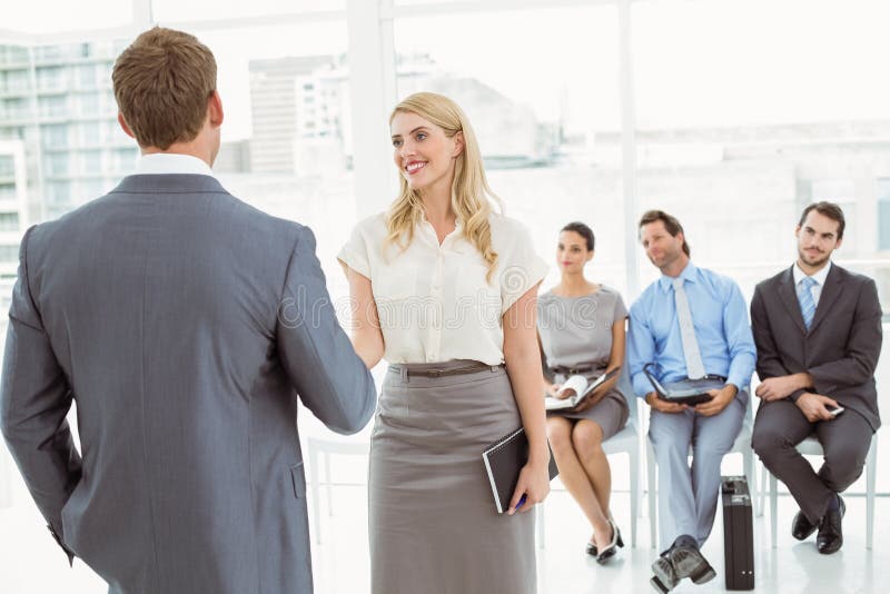 Businesspeople in Front of People Waiting for Interview Stock Image ...