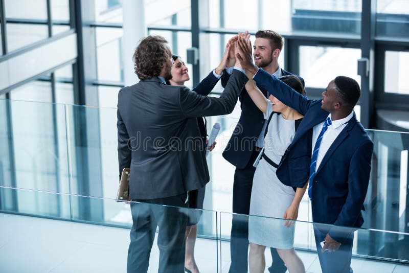Businesspeople Giving High Five To Each Other Stock Photo - Image of ...