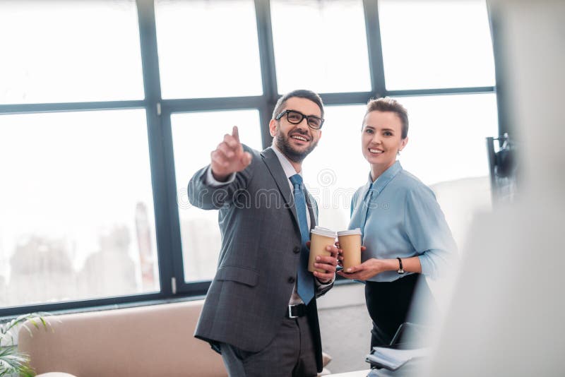 Businesspeople Having Coffee To Go at Office Stock Photo - Image of ...