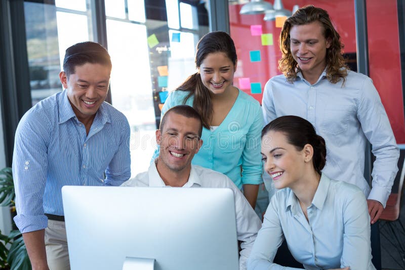 Businesspeople Having Discussion Over Personal Computer Stock Image ...