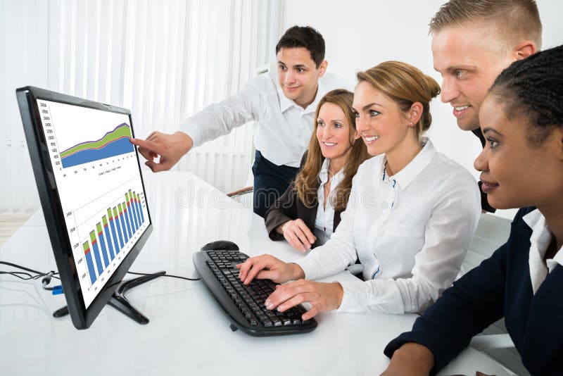 Businesspeople Looking at Graph on Computer Stock Image - Image of ...