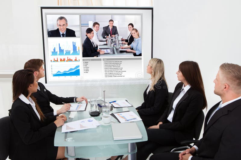 Businesspeople Looking at Projector Screen Stock Photo - Image of ...