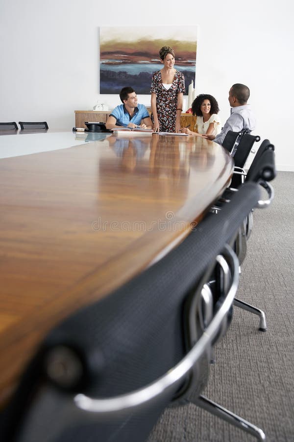 Businesspeople in Meeting at End of Conference Table Stock Photo ...