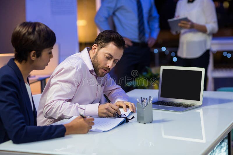 Businesspeople Preparing Document in Conference Room Stock Photo ...