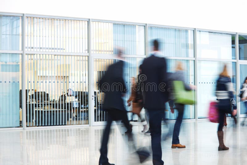 Businesspeople Rushing in Office Building, Motion Stock Image - Image ...