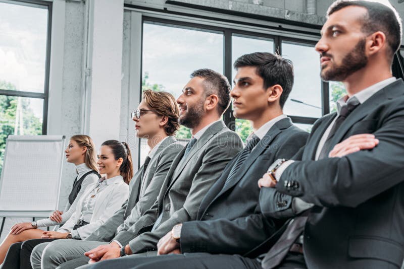 Businesspeople Sitting on Chairs during Training in Hub Stock Image ...