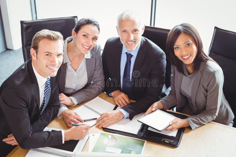 Businesspeople Smiling in Conference Room Stock Image - Image of ...
