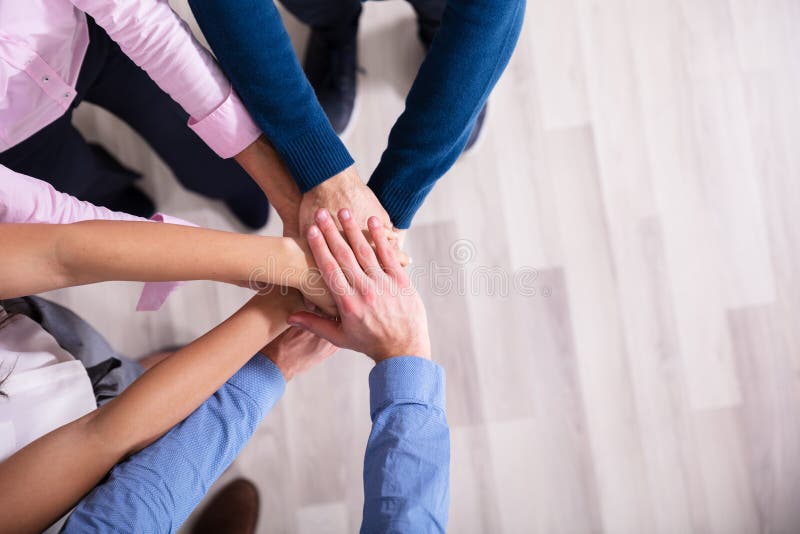 Businesspeople Stacking Hands Over Each Other Stock Photo - Image of ...