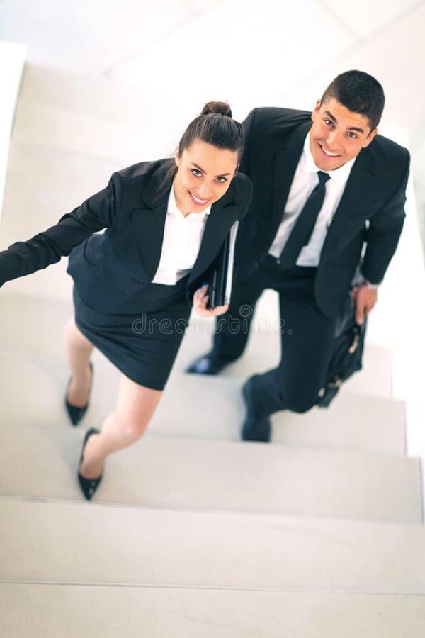 Businesspeople Talking As they Walk into the Office Stock Photo - Image ...