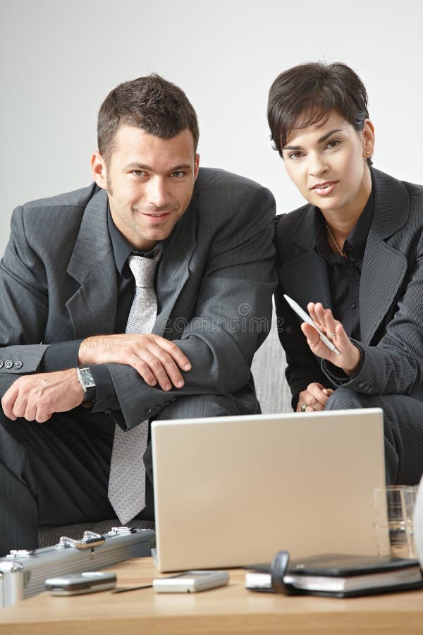 Businesspeople Talking at Office Stock Photo - Image of beautiful ...
