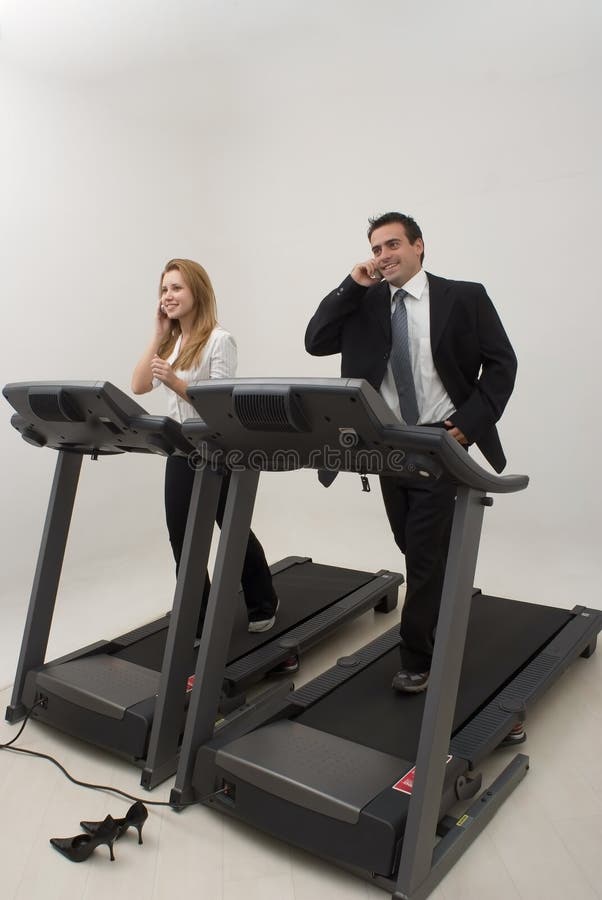 Businesspeople on a Treadmill - Vertical Stock Image - Image of ...