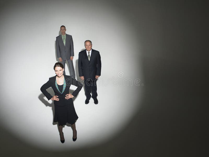 Businesspeople Under Spotlight Stock Photo - Image of mixed, adult ...