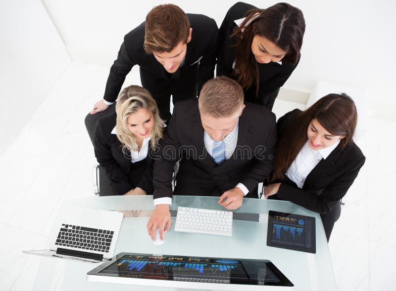 Businesspeople Using Desktop Pc at Desk Stock Image - Image of laptop ...