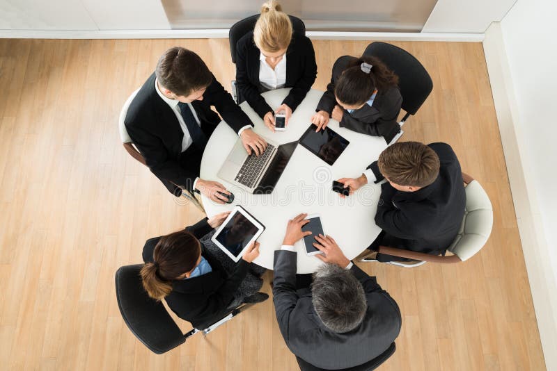 Businesspeople Using Different Electronic Device Stock Photo - Image of ...