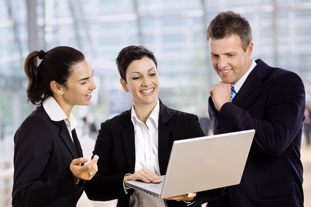 Businesspeople Using Laptop Stock Image - Image of brunette, business ...
