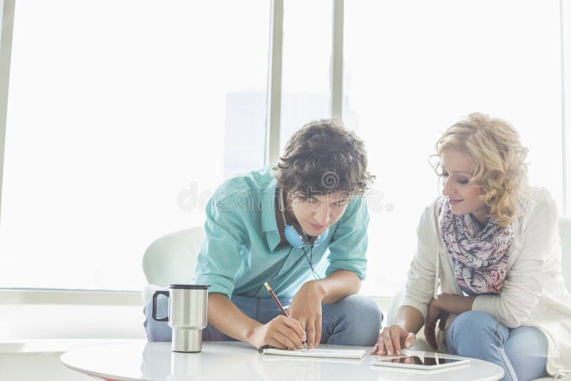 Businesspeople Working at Creative Office Lobby Stock Photo - Image of ...