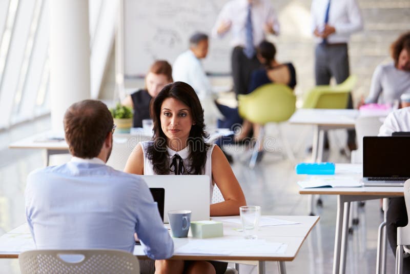 Businesspeople Working at Desks in Modern Office Stock Photo - Image of ...