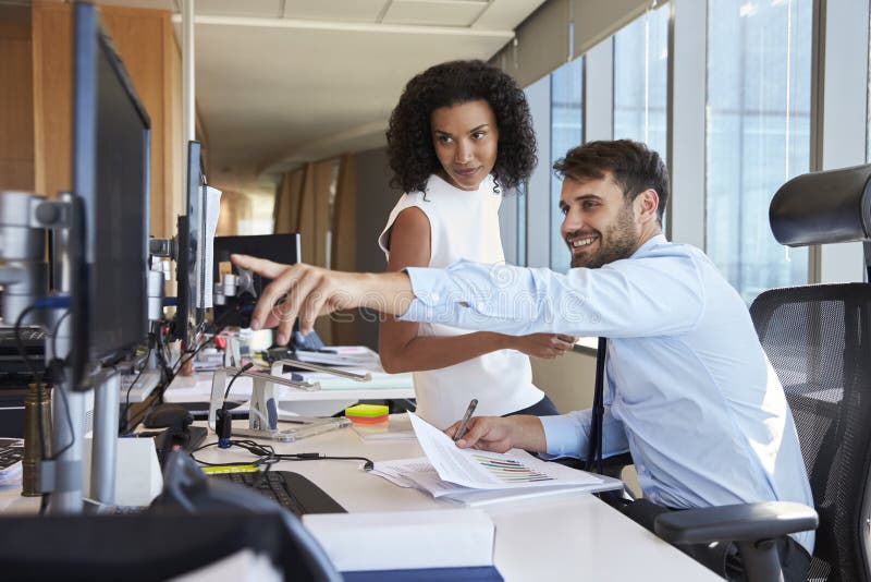 Businesspeople Working at Office Desk on Computer Together Stock Image ...