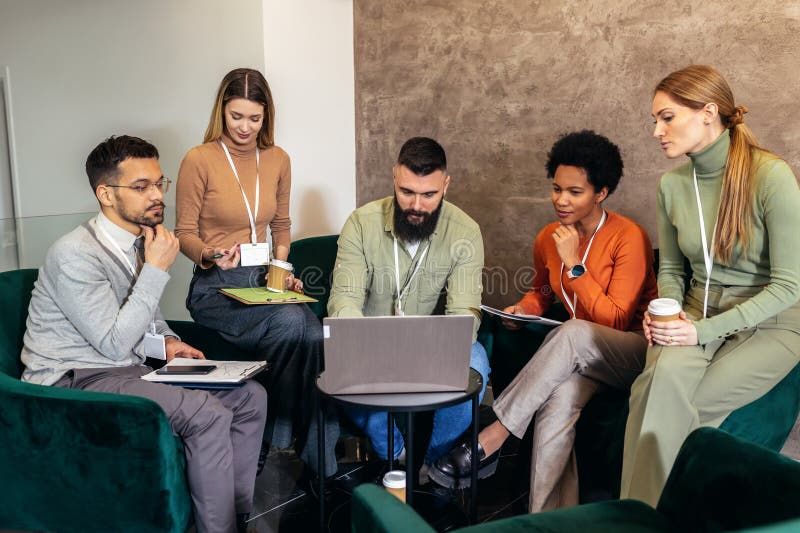 Group of Businesspeople Sitting Together in a Co-working Space Stock ...