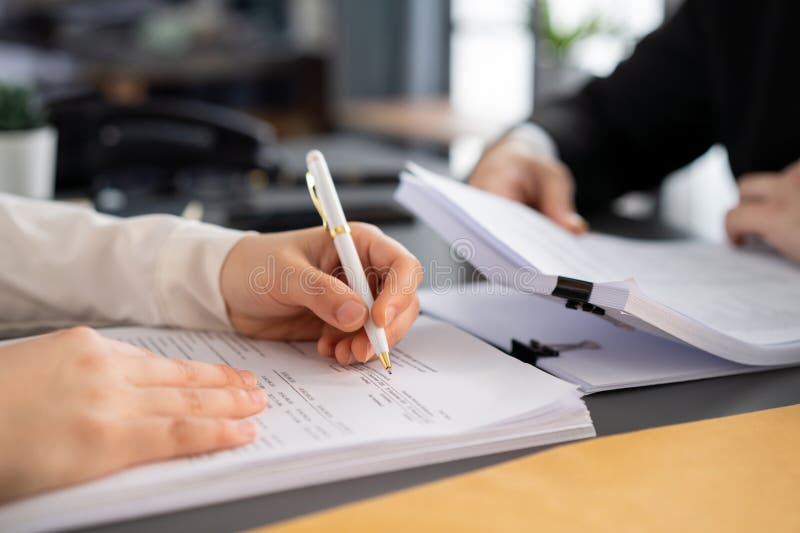 Businesspeople Working in the Office on Official Corporate Papers ...