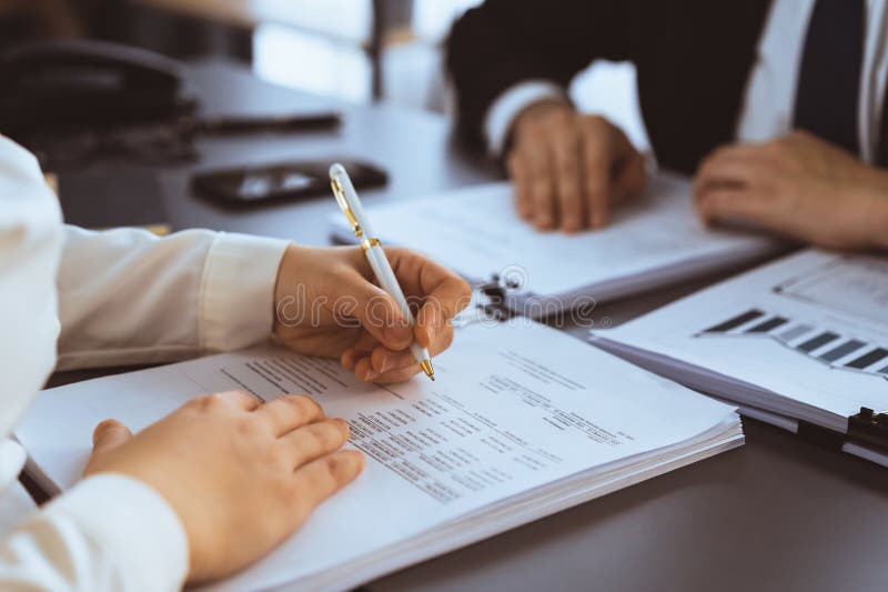 Businesspeople Working in the Office on Official Corporate Papers ...