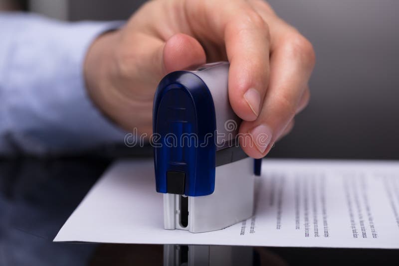 Businessperson Stamping Document in Office Stock Image - Image of ...