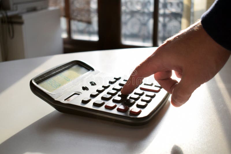 Businessperson Working in Office.Man Hand with Calculator at Workplace ...