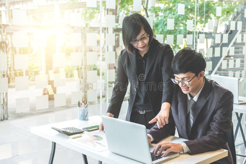 Businessteam Looking at Report and Having a Discussion in Office Stock ...