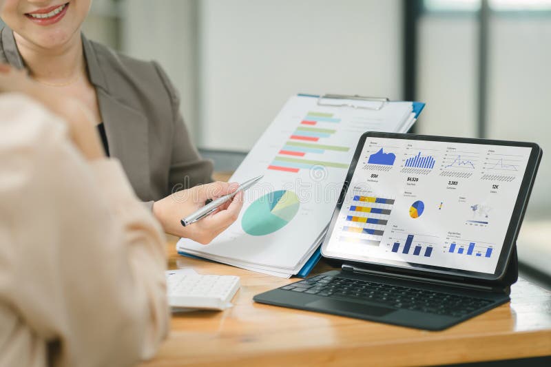 Businesswoman Advisor Team are Analyzing Data Charts, Graphs, and a ...