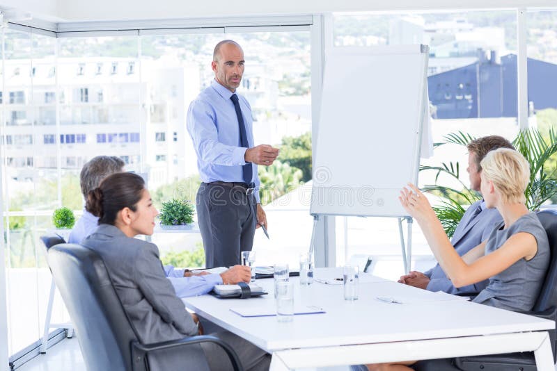 Businesswoman Asking Question during Meeting Stock Image - Image of ...