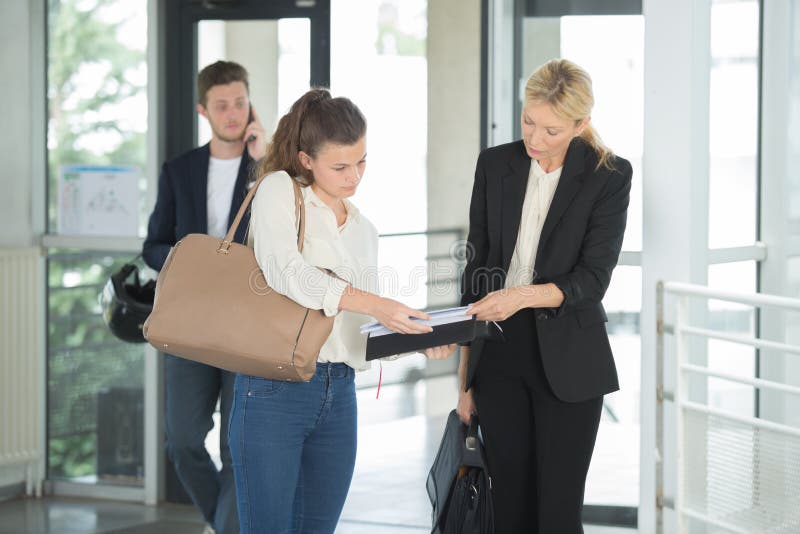 Businesswoman Asks for Directions from Woman Stock Image - Image of ...