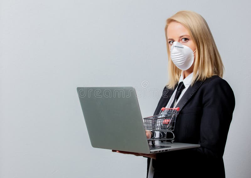 Businesswoman in Black Suit and Face Mask with Computer Stock Photo ...