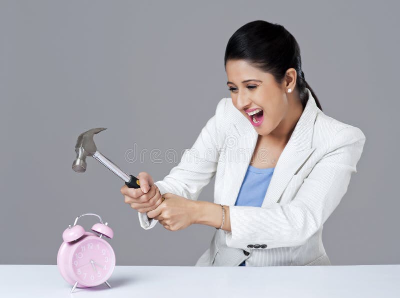 Businesswoman Breaking Alarm Clock Stock Image - Image of breaking ...