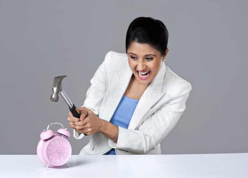 Businesswoman Breaking Alarm Clock Stock Image - Image of aggression ...