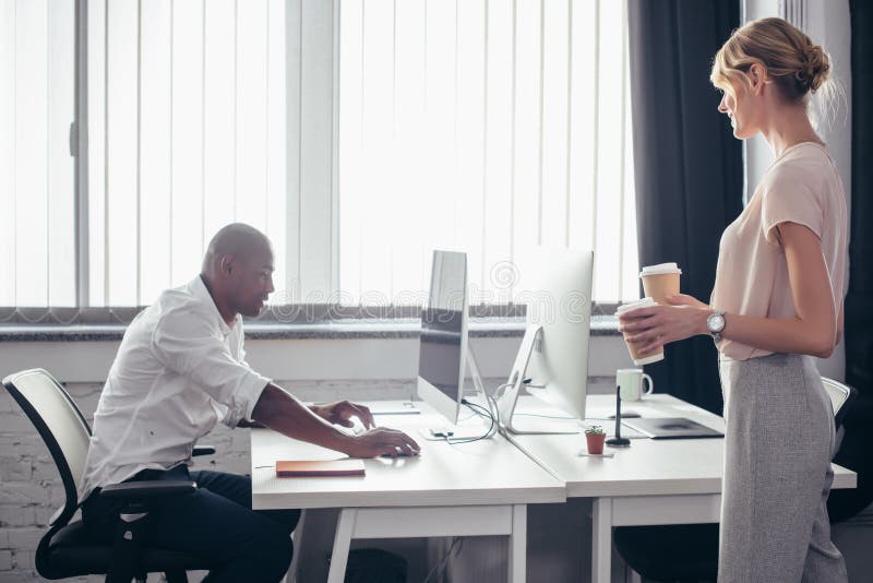 Businesswoman Bringing Coffee To Colleague Stock Image - Image of ... Businesswoman Bringing Coffee To Colleague Stock Image - Image of ...