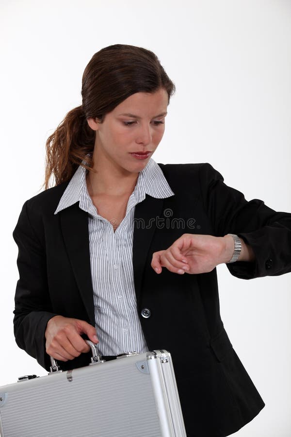 Businesswoman Checking Watch Stock Image - Image of beauty, lady: 30741847