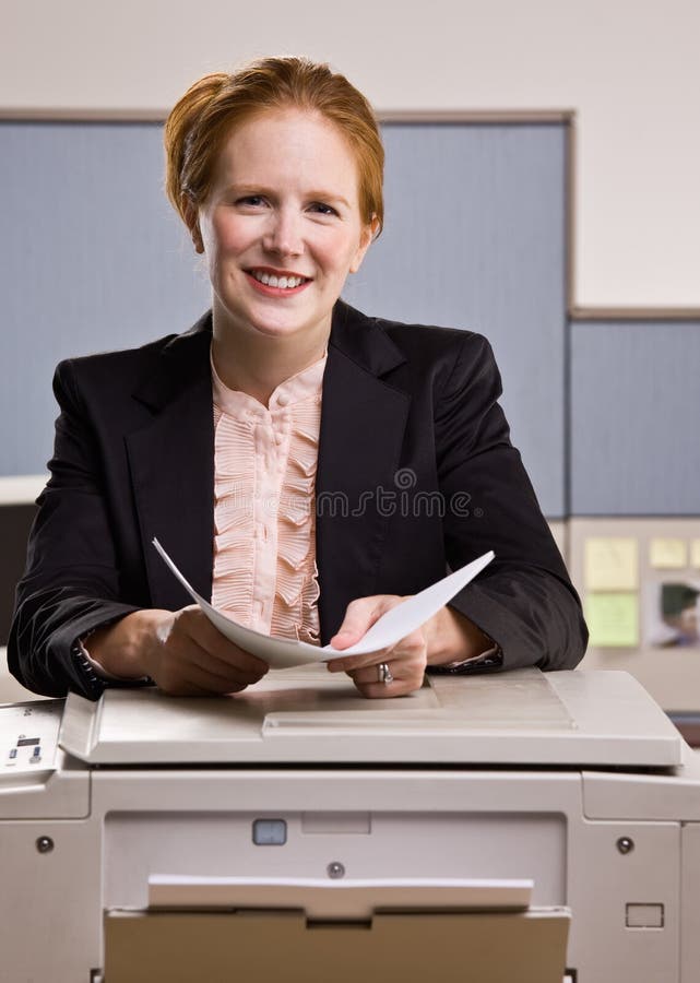 Businesswoman Copying Papers in Office Stock Photo - Image of business ...
