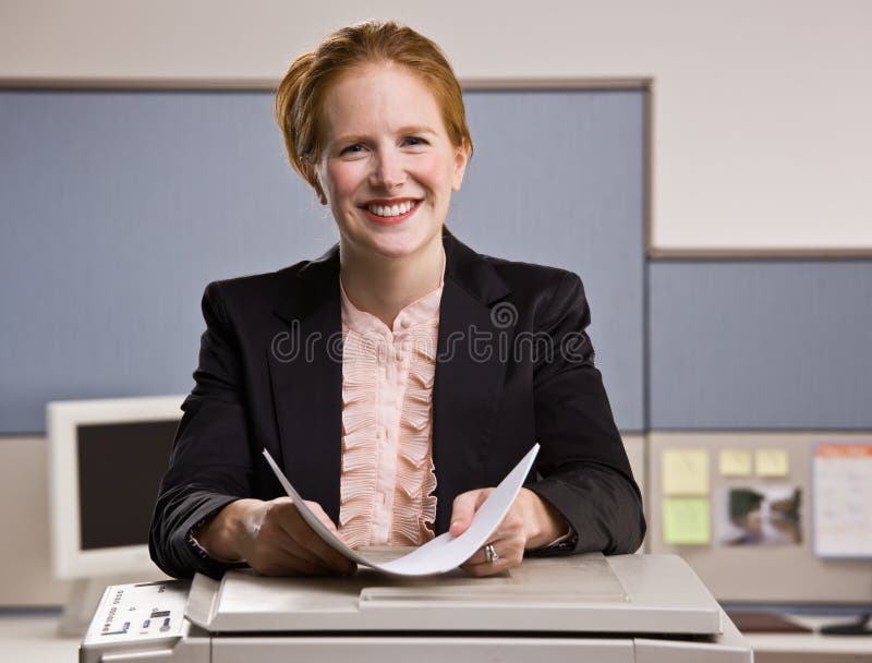 Businesswoman Copying Papers in Office Stock Image - Image of people ...