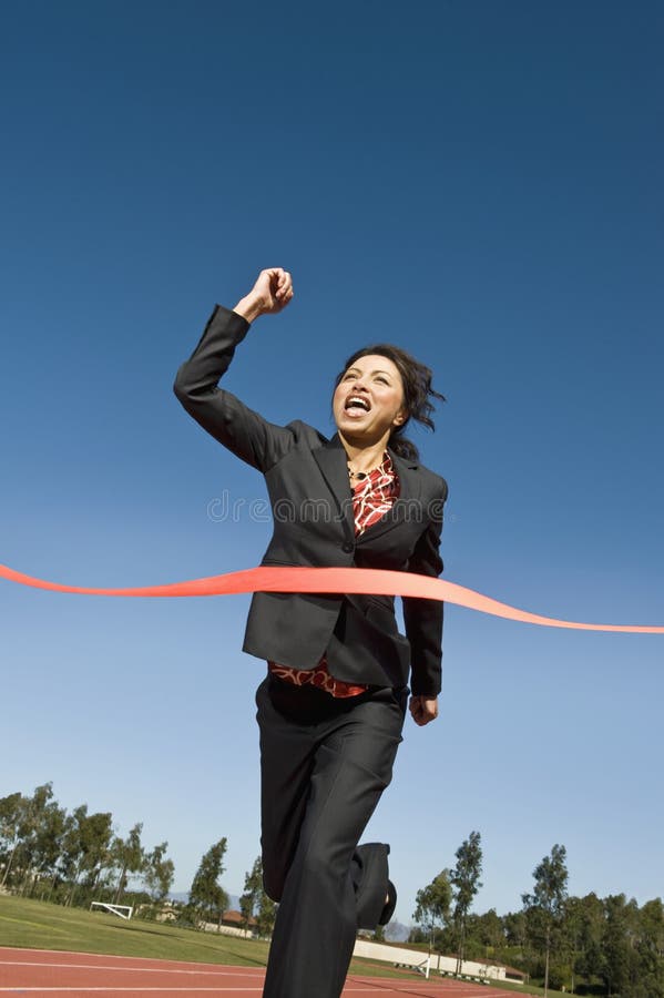 Businesswoman Crossing the Finish Line Stock Image - Image of ...