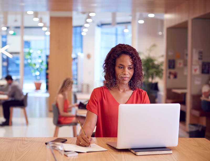 Businesswoman at Desk in Modern Office Work Space with Laptop Stock ...