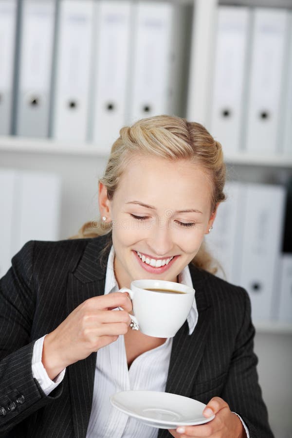 Businesswoman Drinking Coffee in Office Stock Image - Image of ...
